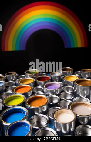 Rainbow, tin metal cans with color paint Stock Photo - Alamy