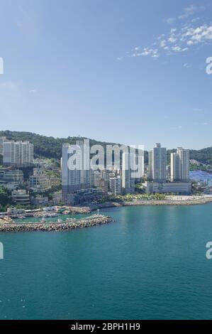 Songdo beach bay in busan, south korea, with urban buildings, green ...
