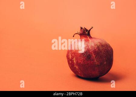 Ripe pomegranate fruit on a old black wooden vintage background ...