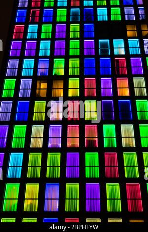 Colored windows texture. Windows illuminated by neon lights background ...