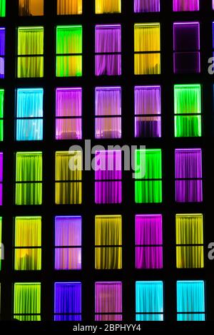 Colored windows texture. Windows illuminated by neon lights background ...