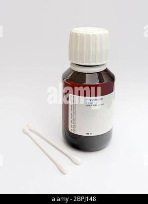 n-Propanol in dark glass bottle used for disinfection. Isolated on ...
