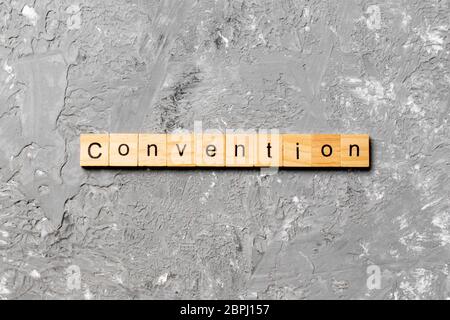 convention word written on wood block. convention text on cement table ...