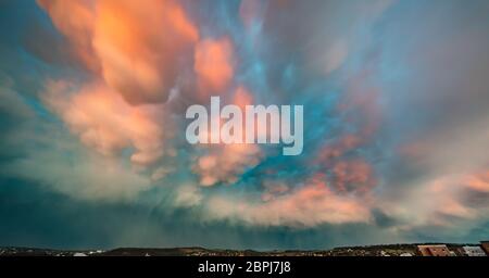 Dramatic sky with thunderclouds. Pink Clouds Illuminated by the Rays of ...