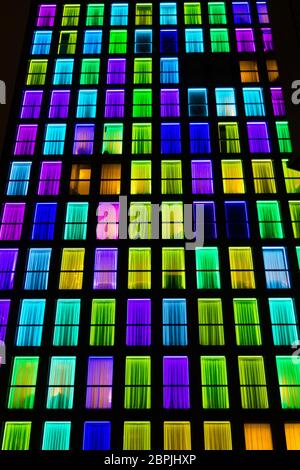 Colored windows texture. Windows illuminated by neon lights background ...