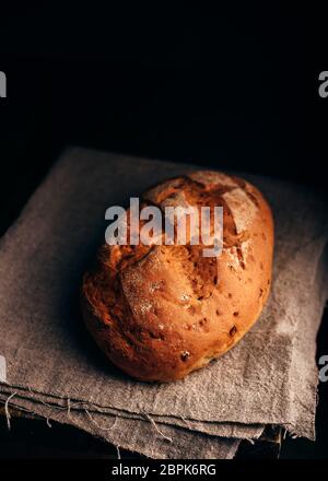Loaf of Bread on Grey Cloth. Dark Background and Copy Space on the Top ...