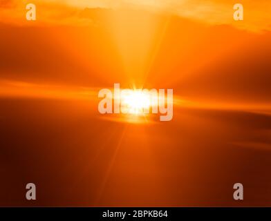 Dramatic God rays during burning sunset background Stock Photo - Alamy