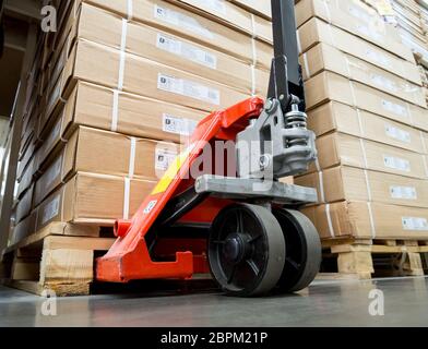 High rack stacker forklift truck in warehouse rows Stock Photo - Alamy