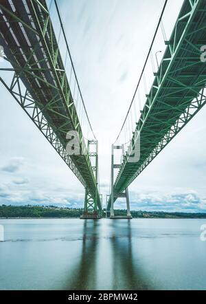 The narrows bridge across Puget Sound in Tacoma, Washington is twisted ...