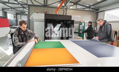 Large group of worker printmaker technician operator works in digital ...