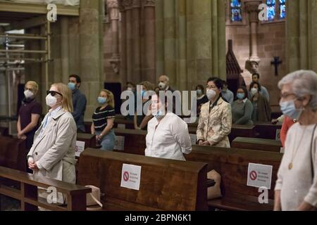 Believers pray while wearing face masks as a preventive measure on the ...