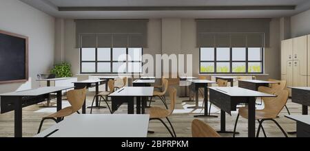 Side view of an empty classroom, with desks in formation and blackboard behind them, with open ...