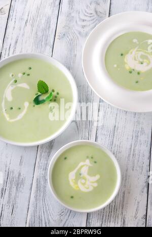 Portions of pea cream soup Stock Photo - Alamy