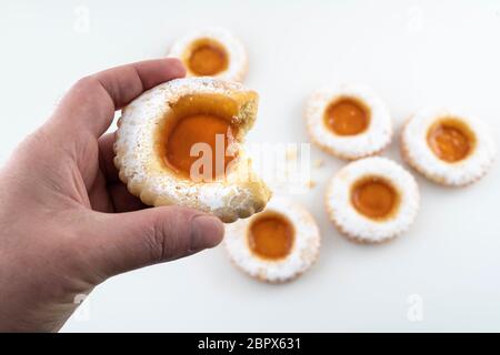 round pastries of pastry and jam on a white surface Stock Photo - Alamy