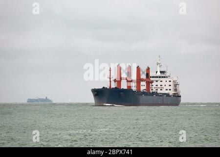 Industrial ship coming in port Stock Photo - Alamy