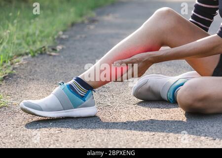 The female clings to a bad leg. The pain in her leg. Health and painful ...