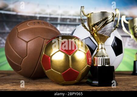 Winner trophy, Sport equipment and balls Stock Photo - Alamy