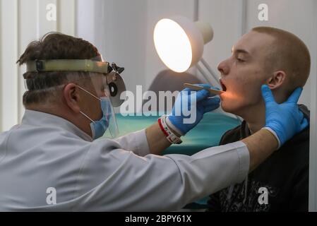 An army conscript undergoes medical examination at the Moscow Stock ...
