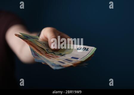 Money (Euro) in a hand isolated on white Stock Photo - Alamy