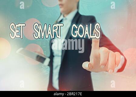 Writing note showing Set Smart Goals. Business concept for list to ...