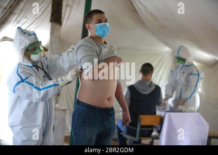 An army conscript undergoes medical examination at the Moscow Stock ...