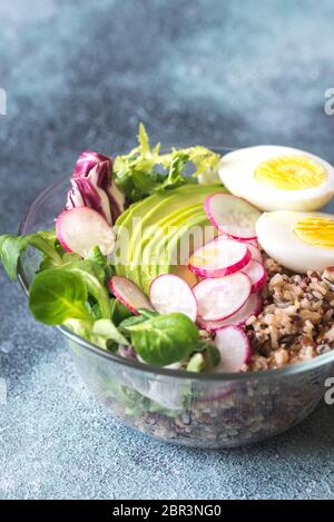 Bowl of wild rice with avocado, egg and lettuce Stock Photo - Alamy