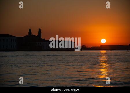 Breathtaking sunset over the lagoon of Venice and the Basilica of Santa ...