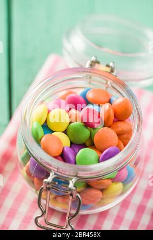 Colorful chocolate candy pills in jar Stock Photo - Alamy