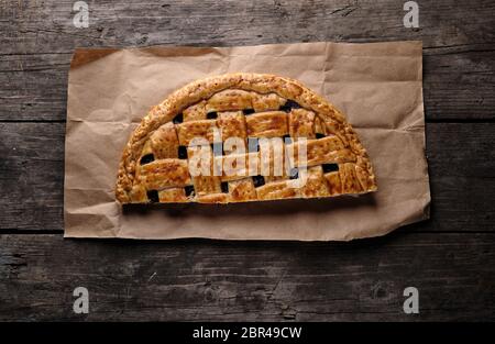 half cherry pie on brown paper, top view Stock Photo - Alamy