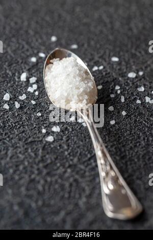 Table salt on teaspoon, table salt, sodium chloride, salt crystals ...