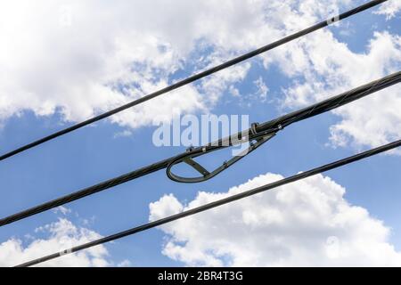 Snowshoe fiber optic radius limiter alongside overhead power lines ...