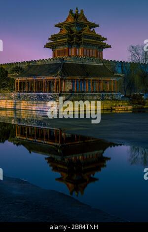 The wall and frozen moat of the Forbidden City at sunset. Beijing ...
