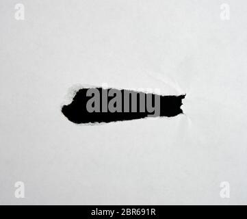 white sheet of paper with a hole, full frame, black inside Stock Photo ...