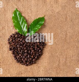 roasted coffee bean with leave on linin sack Stock Photo - Alamy