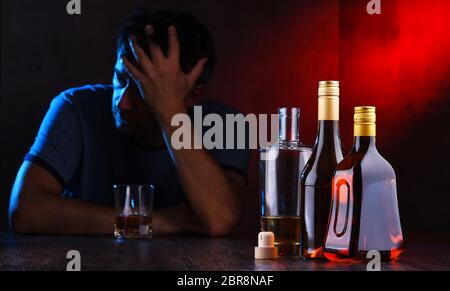 Bottles with alcoholic beverages and the figure of a drunk man Stock ...