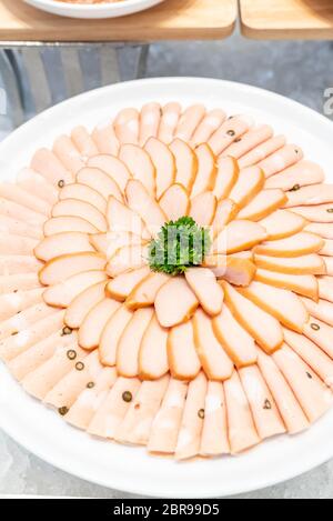 Chicken white sausage with salad leaves Stock Photo - Alamy