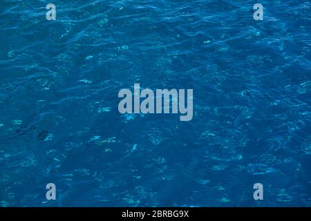 Closeup of rough water surface texture with splashes and bubbles in ...