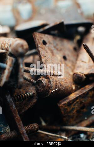 Scrap metal. Rusty screws, latches, curtain. Rust texture. Close-up ...