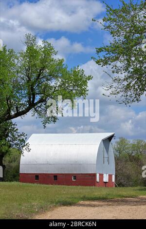 Kansas Red Barn in a Field with Blue Skies and Clouds Stock Photo - Alamy