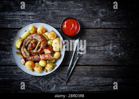 Plate of gherkins, pickled cucumbers on a white rustic wooden ...