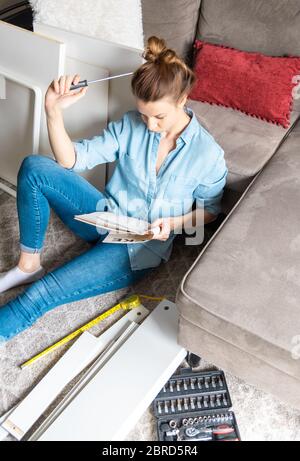 woman and apartment house assembling Stock Photo - Alamy