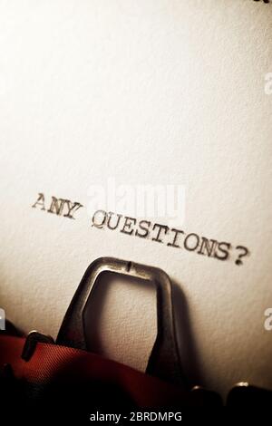 Any questions? text written with a typewriter Stock Photo - Alamy