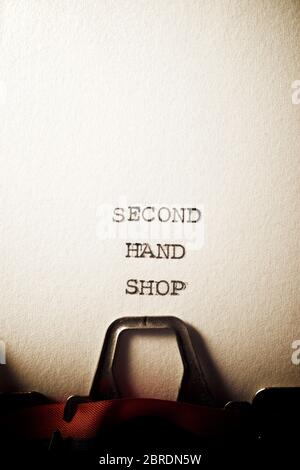 Second hand store written with a typewriter Stock Photo - Alamy