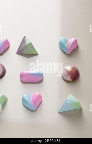 Modern chocolate candies pastel colour Stock Photo - Alamy