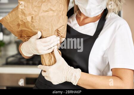 Happy woman florist holds paper and beautiful bouquet of boutique Stock ...