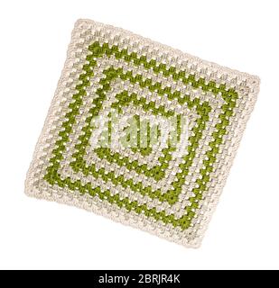 Closeup Crochet handmade square pattern, pink yarn coil, hook, knitting ...