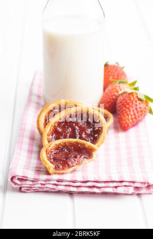 Homemade strawberry jam, on napkin, on color wooden background Stock ...