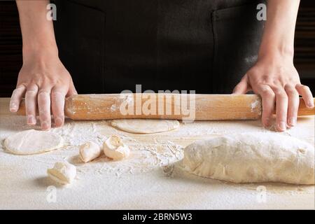 Step by step. Rolling dough for home made empanadas Stock Photo - Alamy