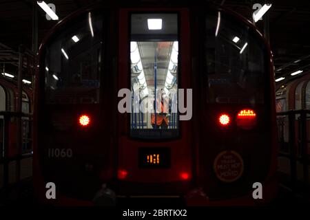 A TfL worker deep cleans a Victoria Line tube train at the London ...