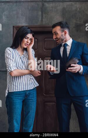 Bankrupt businessman angry and upset at home Stock Photo - Alamy